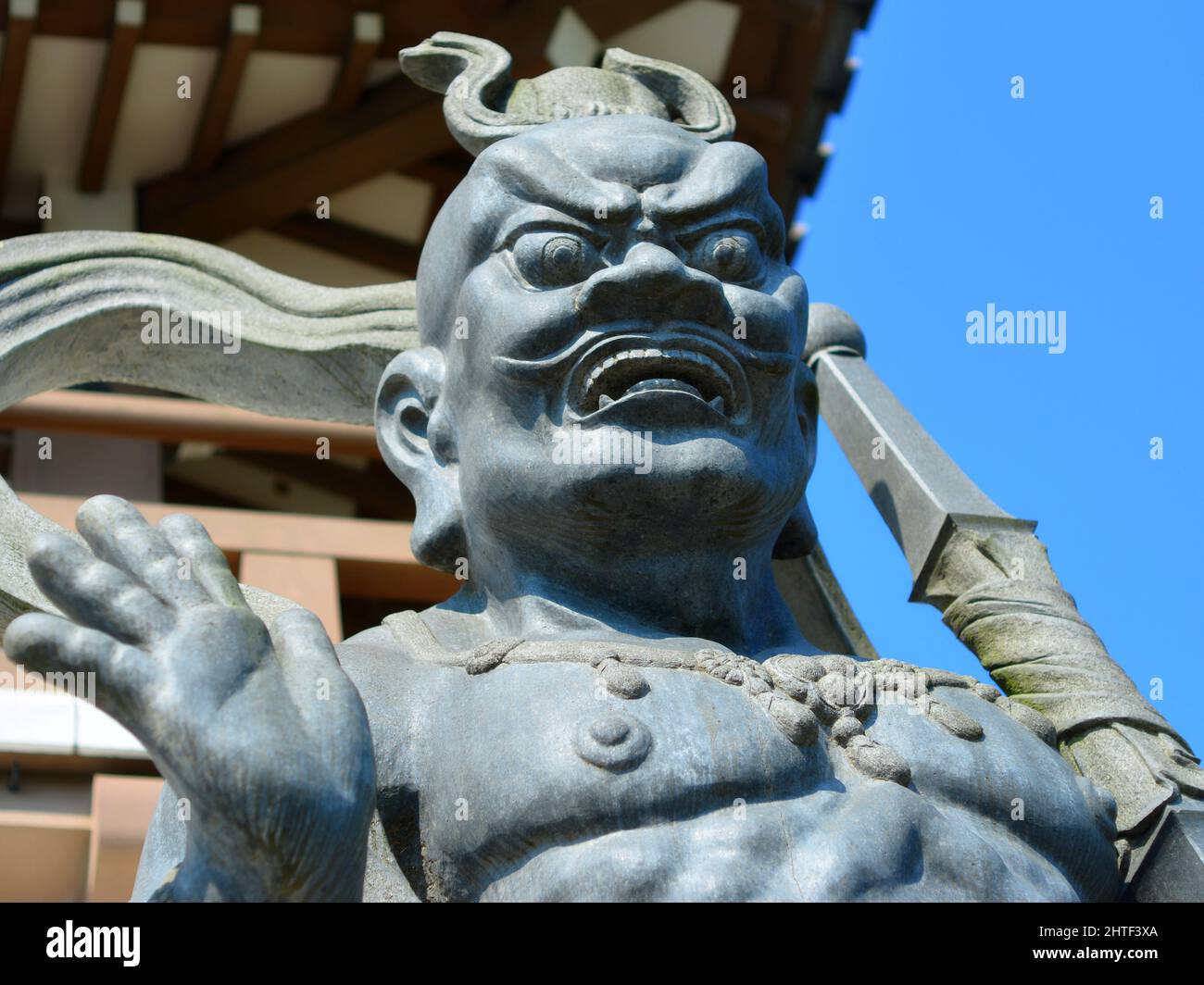 Guardian sculpture in a Japanese temple in Osaka Stock Photo - Alamy