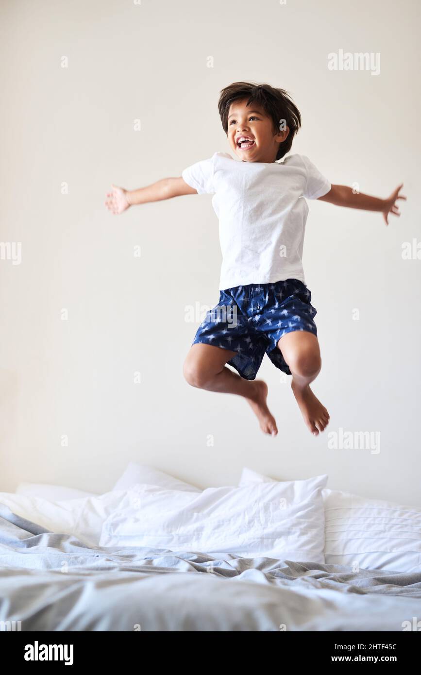 Flying solo. Full length shot of an adorable little boy playing and ...
