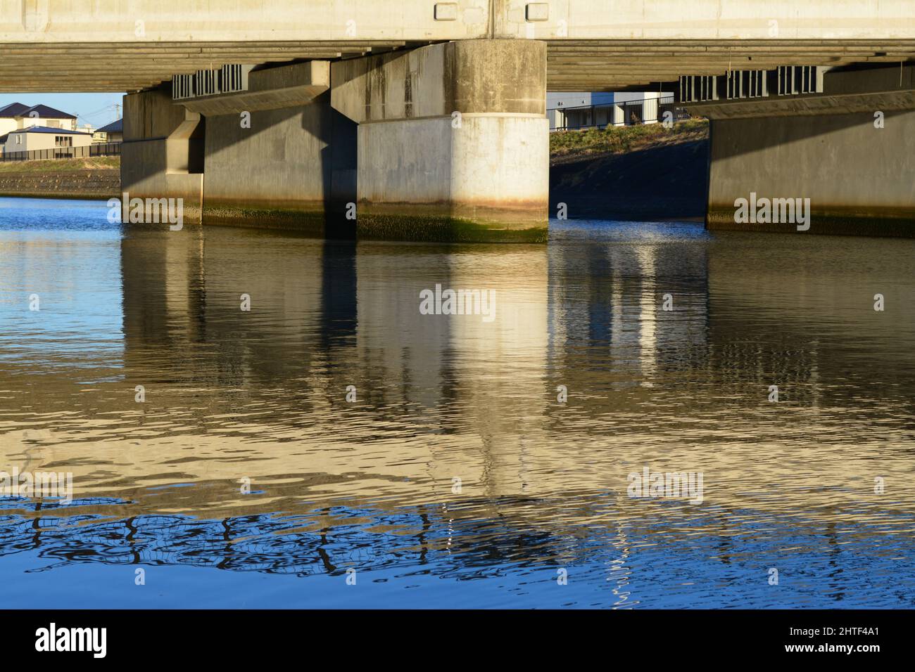 Concrete bridge over the Japanese river with reflection Stock Photo - Alamy