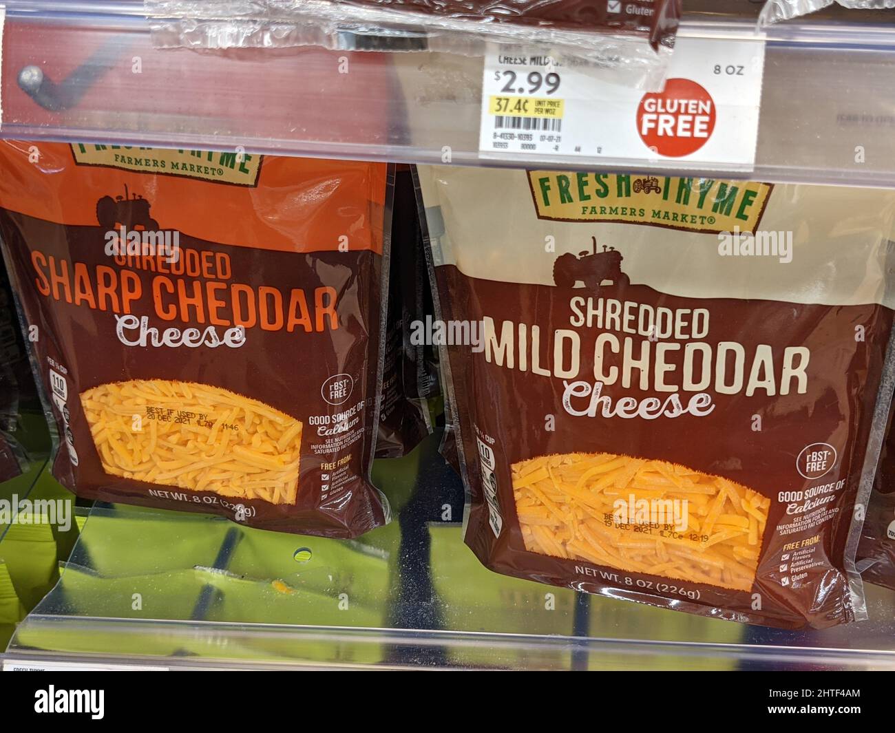 Fresh Thyme shredded cheddar cheese in the store Stock Photo - Alamy