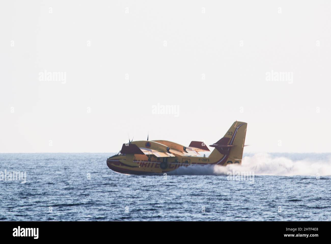Yellow hydroplane landed on the water Stock Photo - Alamy