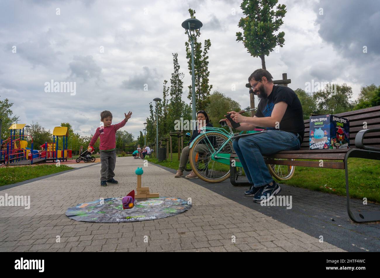 Photo of a young boy throwing balls of an Angry Birds outdoor game in ...