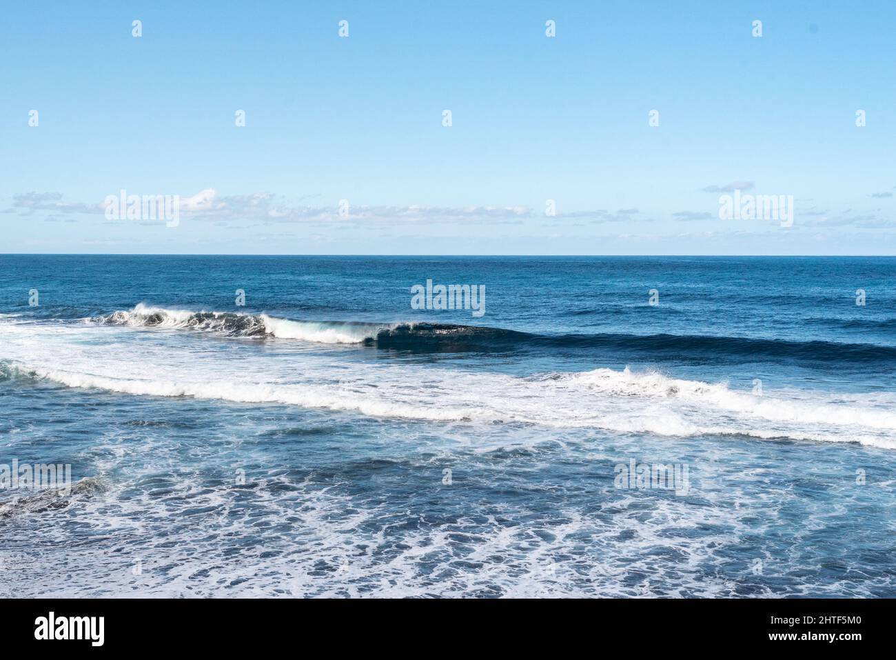 A-frame of a beach break wave Stock Photo - Alamy