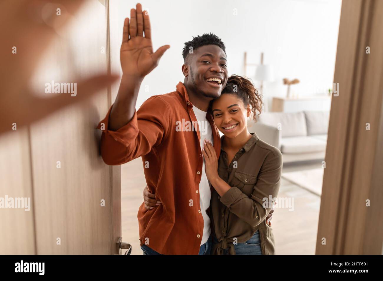 Hand waving hi-res stock photography and images - Alamy