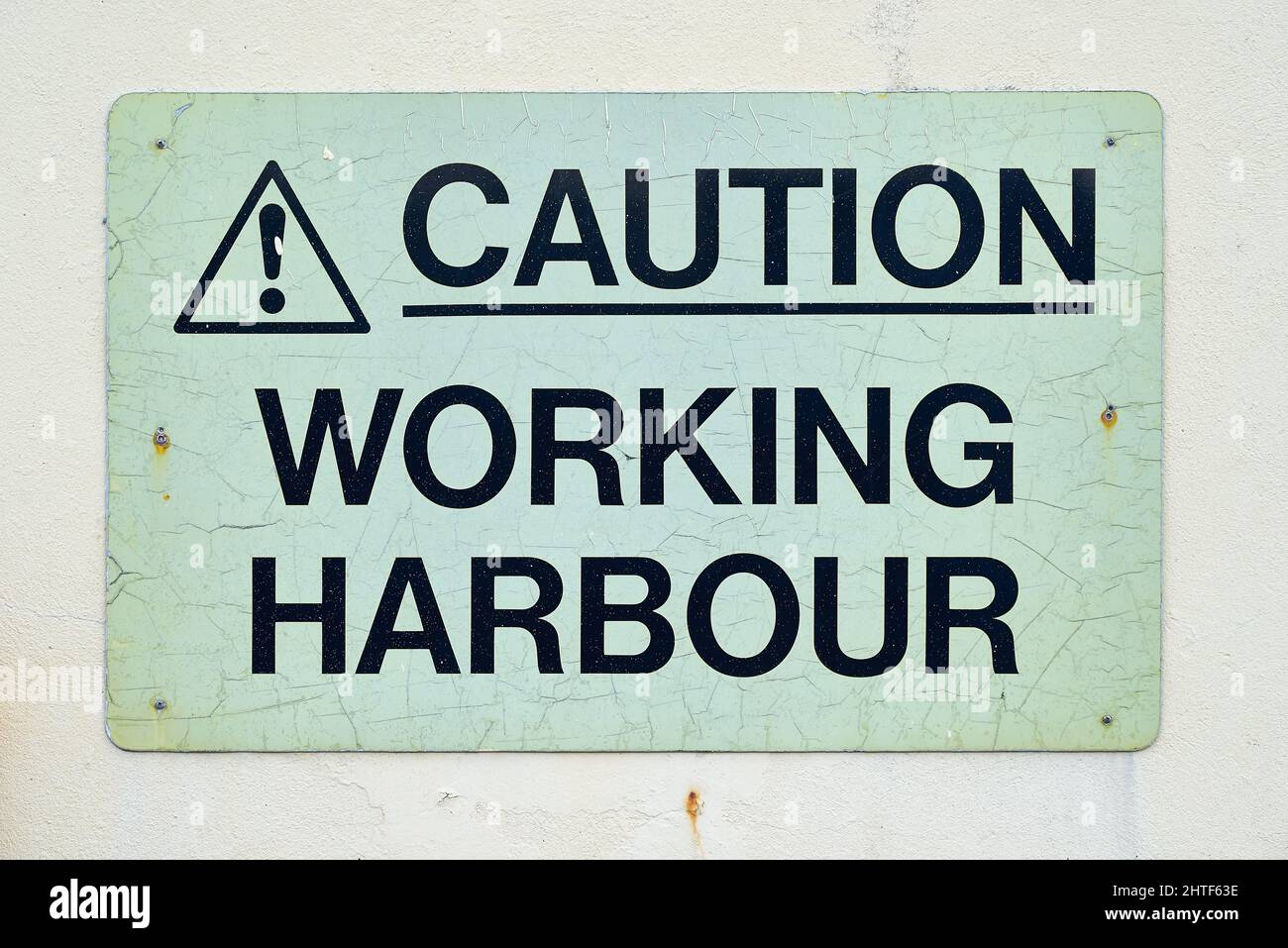 Working Harbour caution sign Stock Photo - Alamy