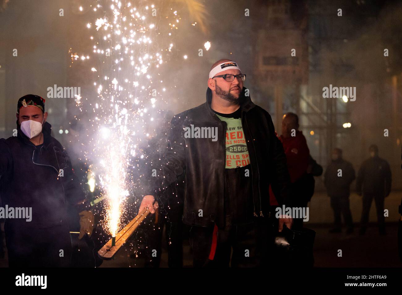 A professional rocket shooter doing a fireworks demonstration before ...