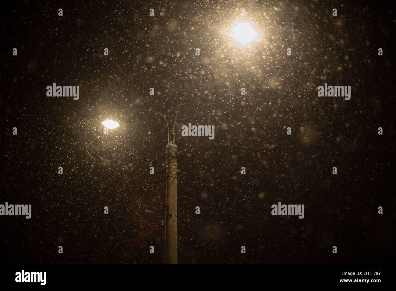 Snow falling in night sky hi-res stock photography and images - Alamy