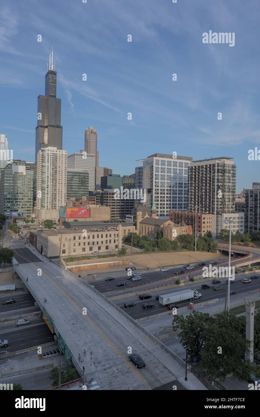 Vertical shot of perpendicular bridge highways in the background of a ...