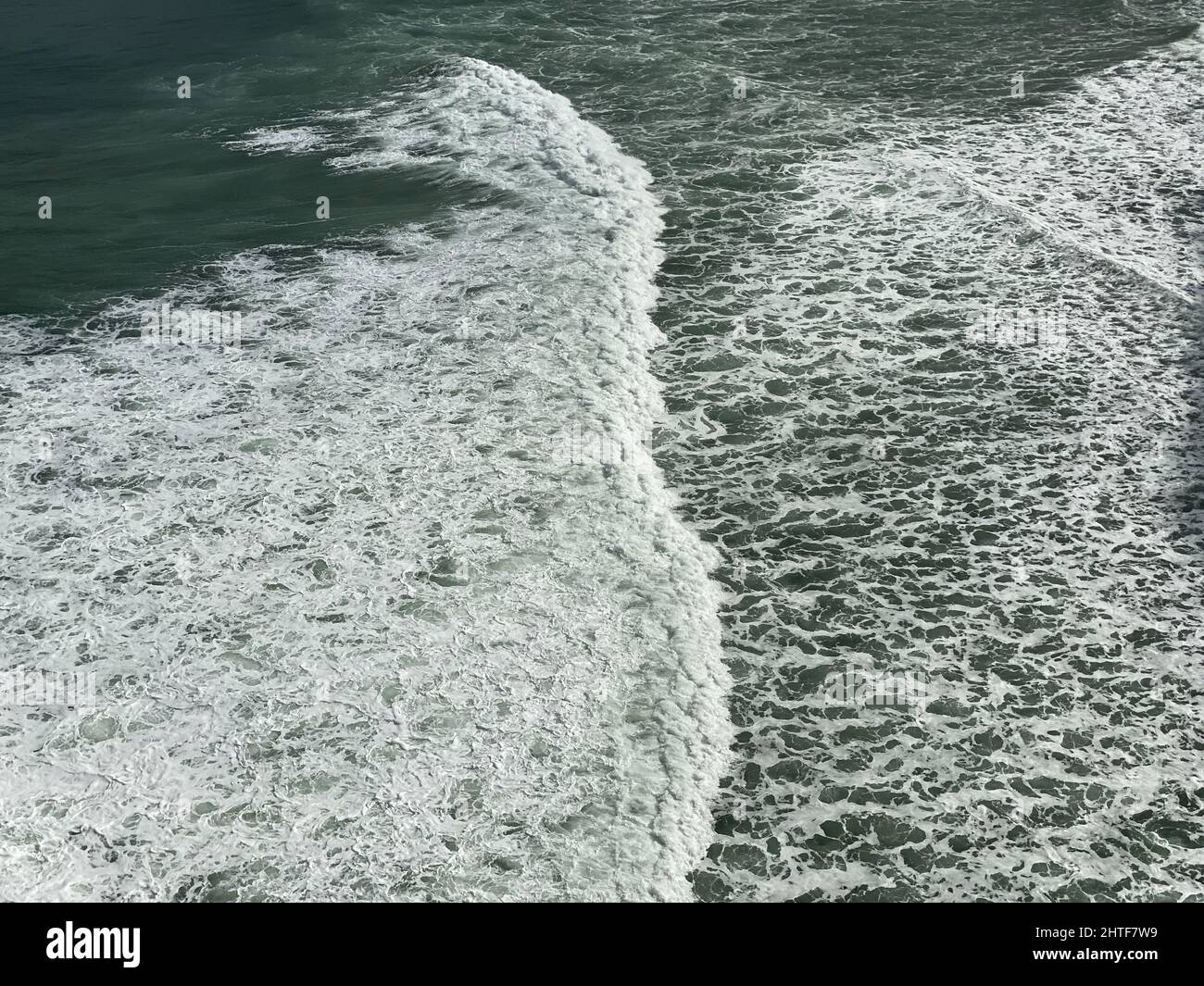 Beautiful view of splashing sea waves under the sunlight Stock Photo ...