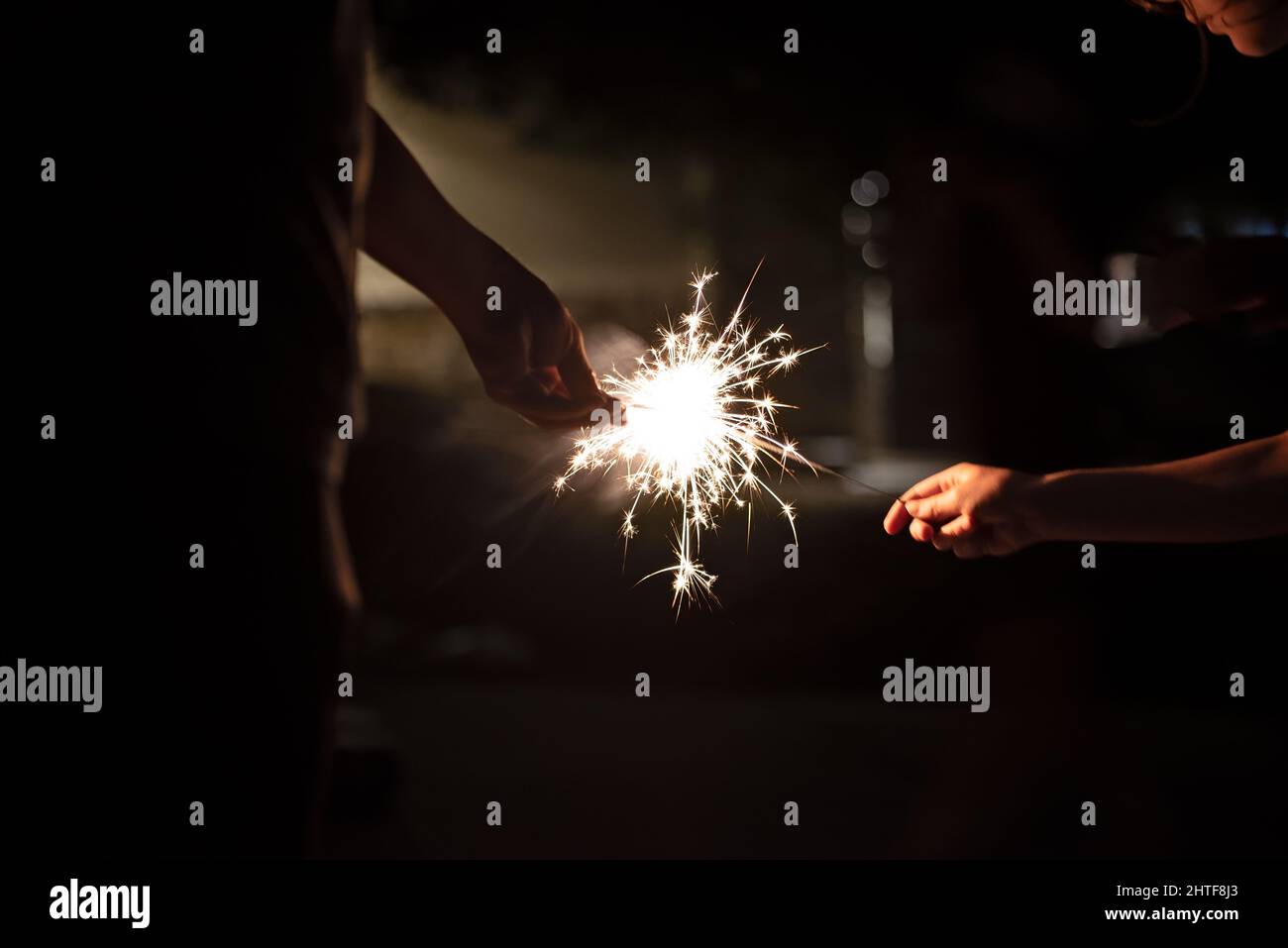 Children lighting fireworks hi-res stock photography and images - Alamy