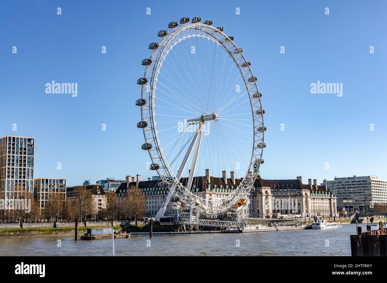 The London Eye is an iconic London landmark and tourist attraction seen ...