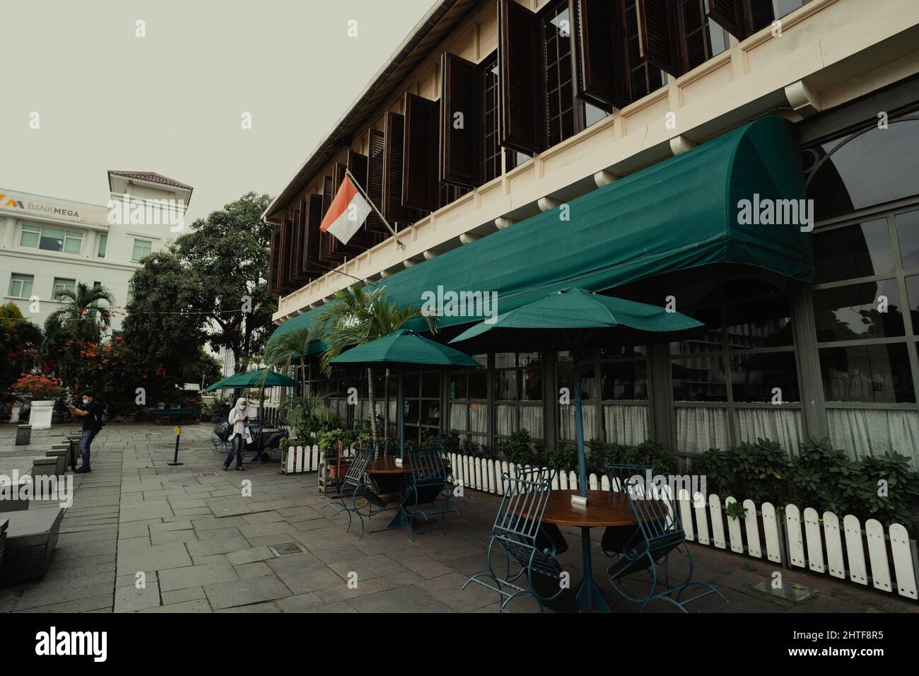 Old cafe Batavia in Kota Tua Old Town Jakarta with the Indonesian flag ...