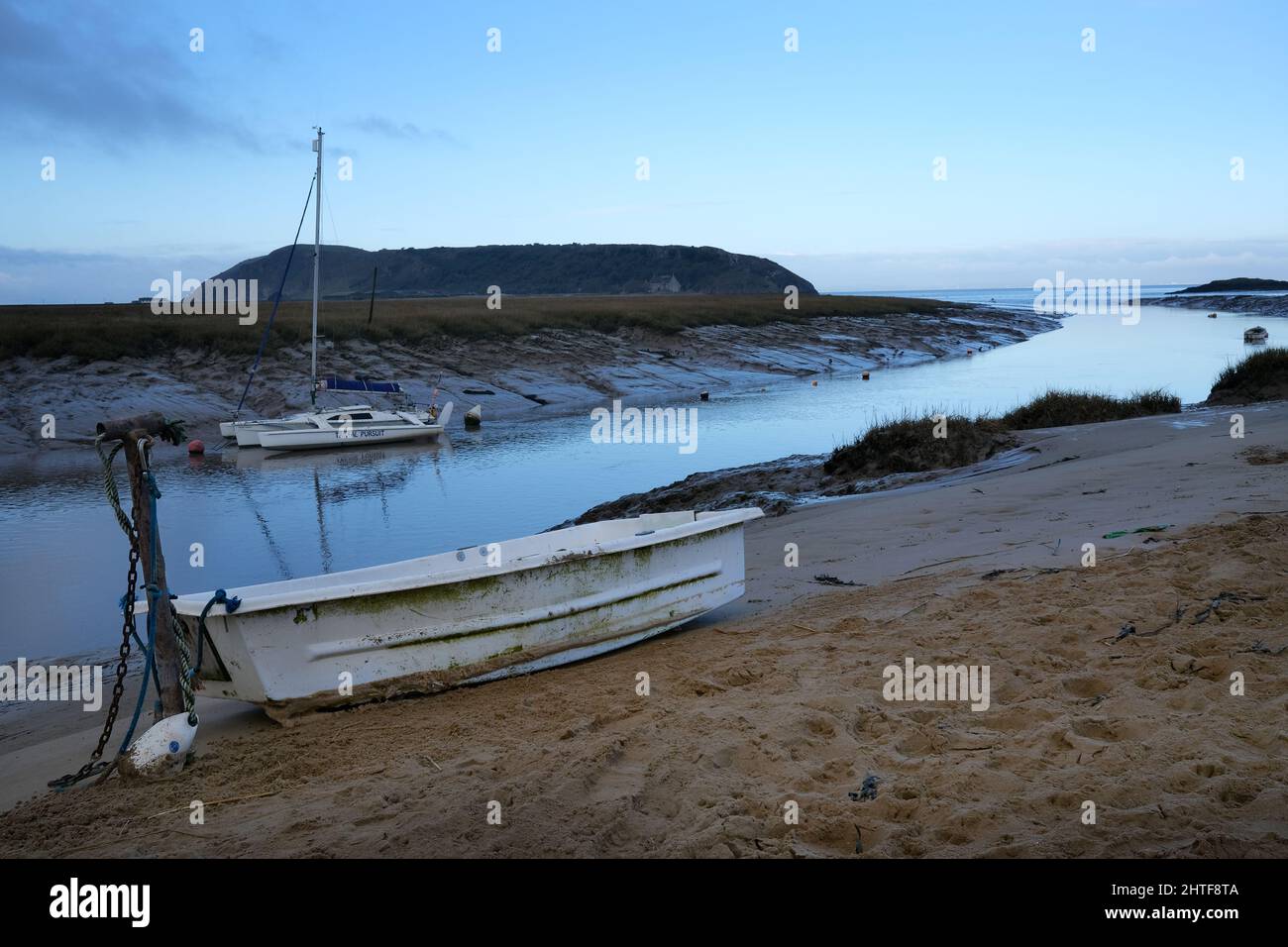 January 2022 - Calm morning with a few boats on the beach at Uphill ...