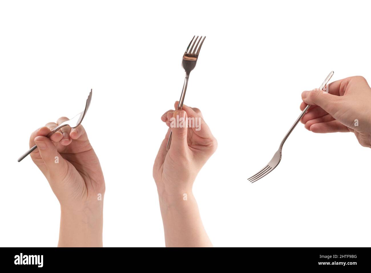 Fork in woman hand isolated on white background Stock Photo - Alamy