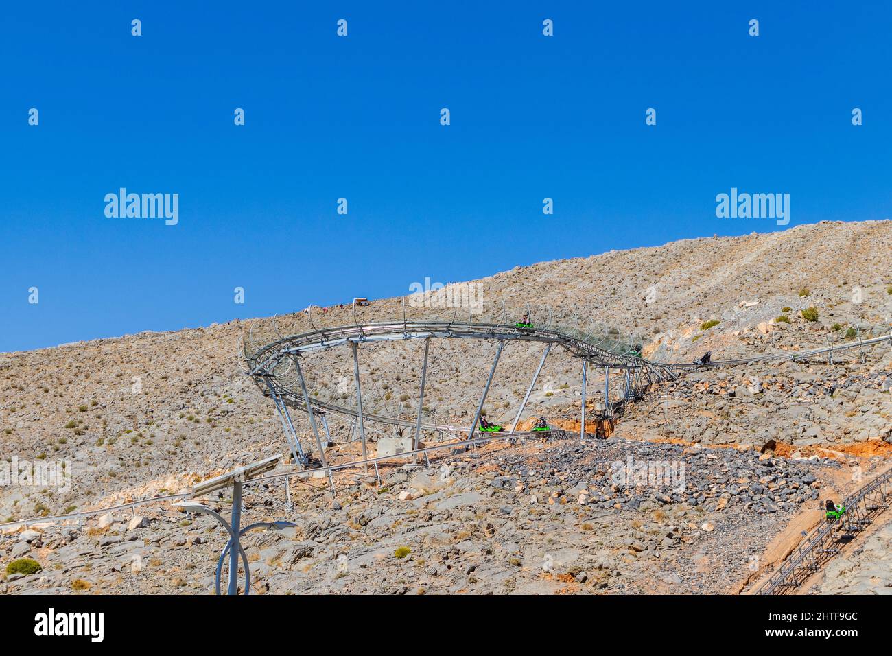 Outdoor roller coaster attraction in the mountains Stock Photo - Alamy