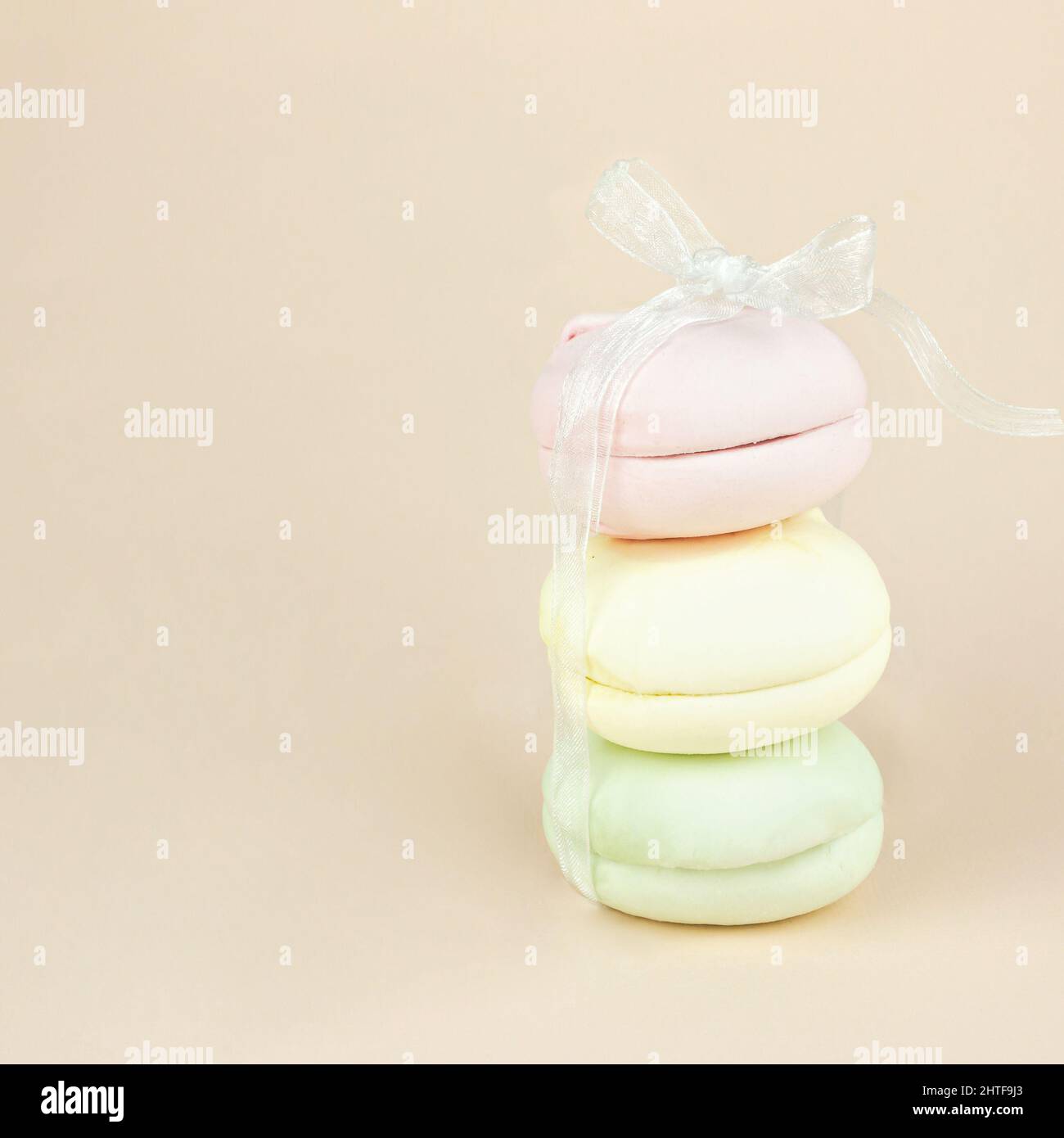 Colorful marshmallows looks like french macarons with white ribbon bow ...
