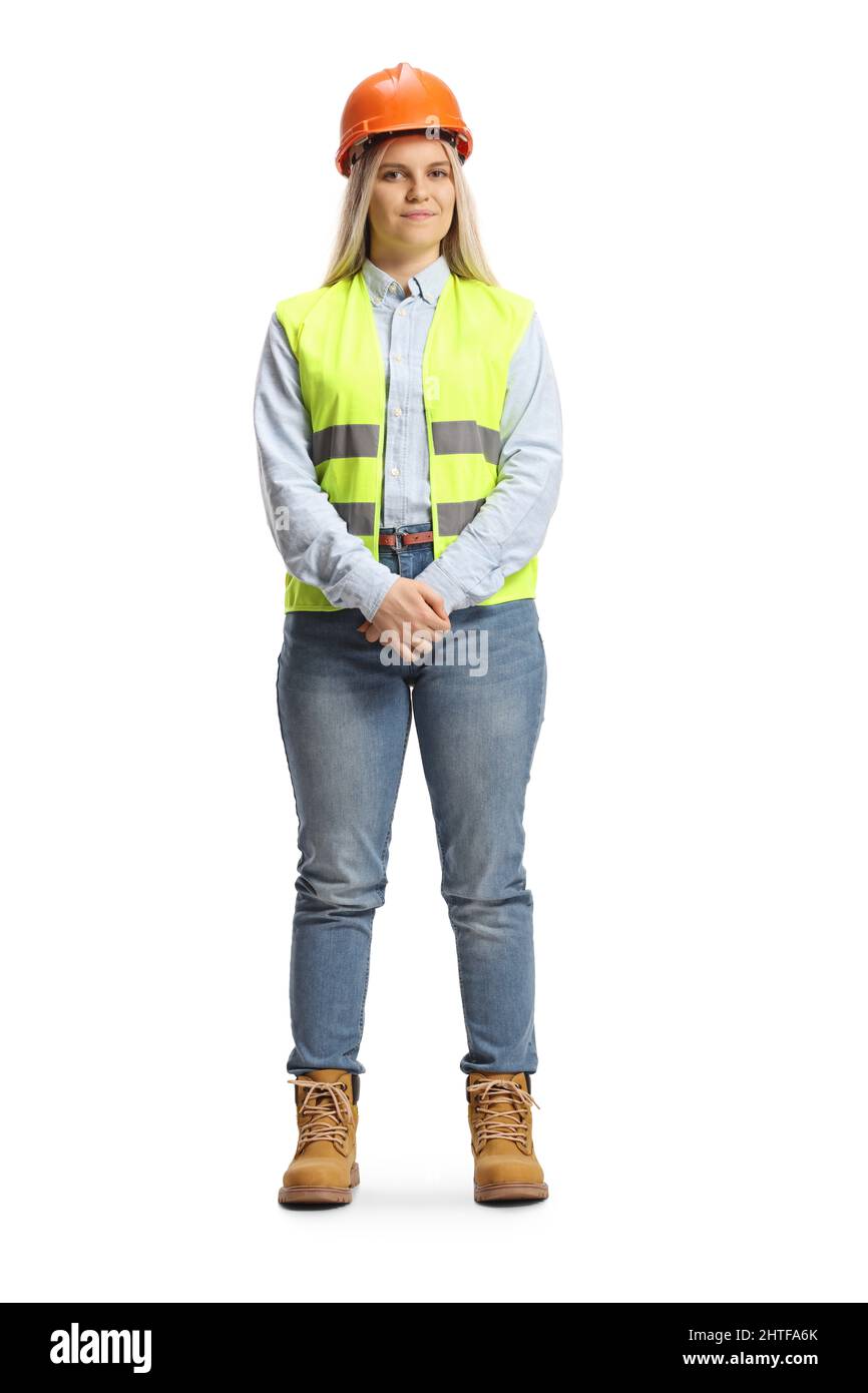 Full length portrait of a young female engineer wearing safety vest and ...