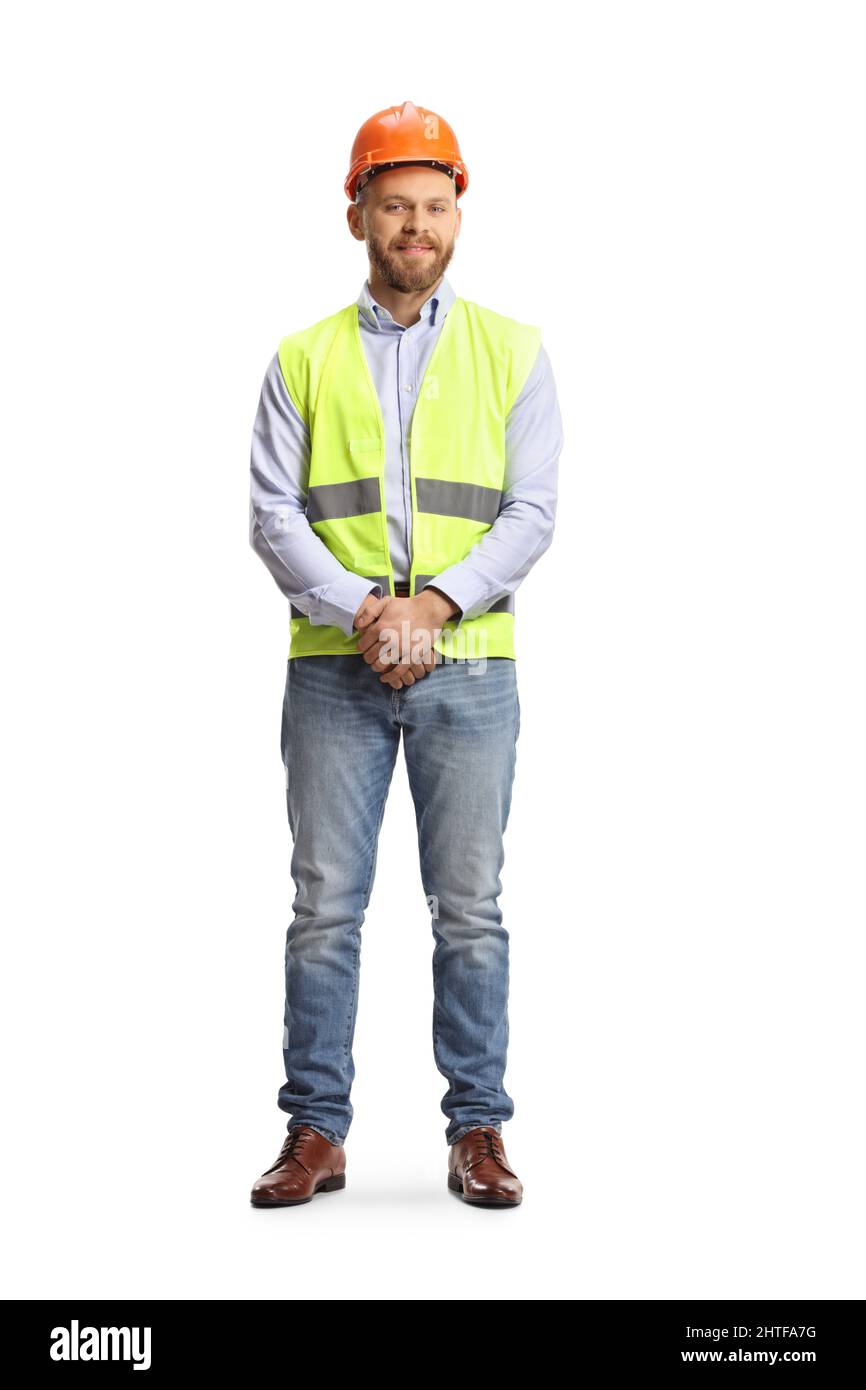 Full length portrait of a young male site engineer wearing safety ...