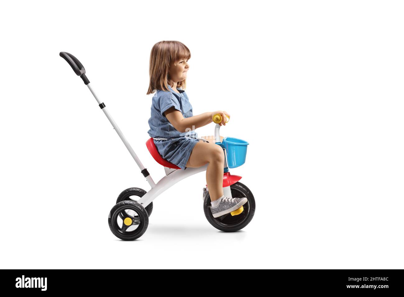 Happy child riding tricycle Cut Out Stock Images & Pictures - Alamy