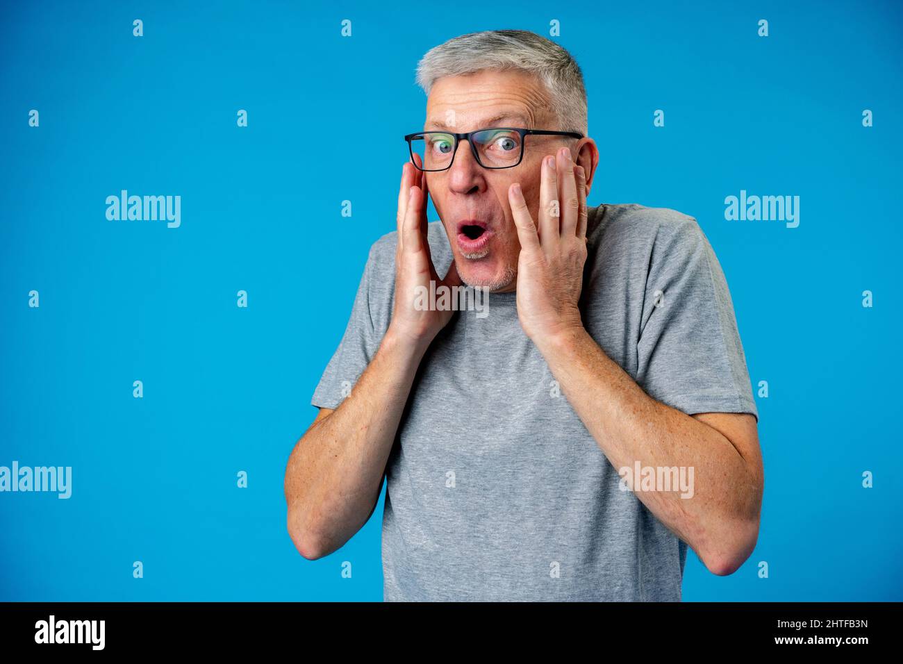 Scared middle age man nervous expressing anxiety and panic gesture ...