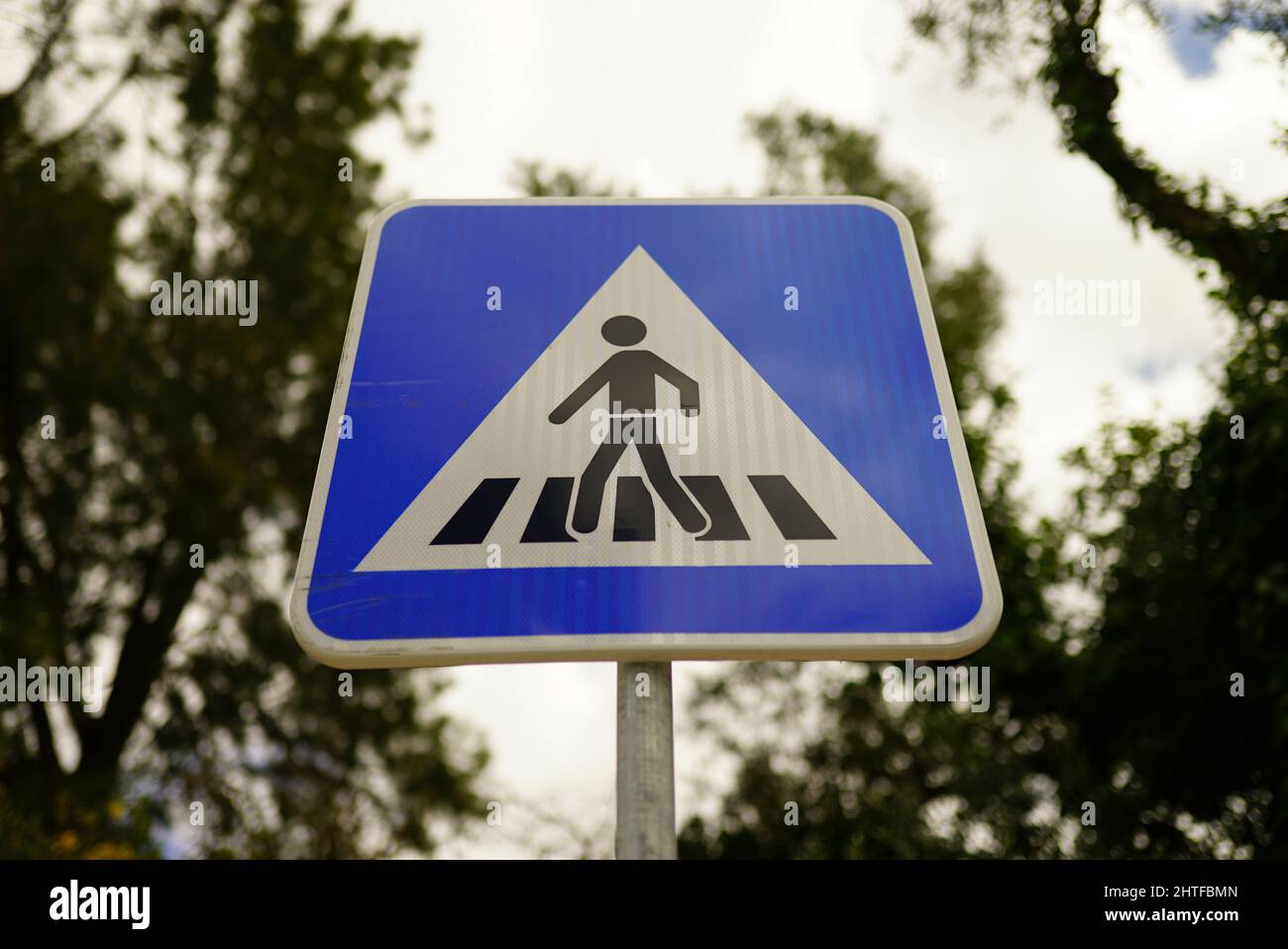 Low angle shot of crosswalk sign Stock Photo - Alamy