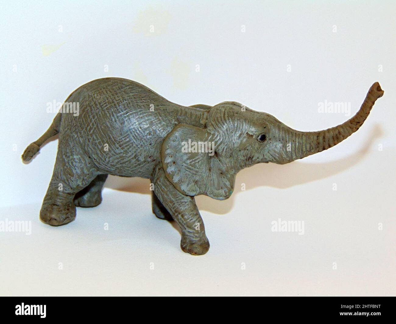 High angle of an plastic elephant toy isolated on white Stock Photo - Alamy