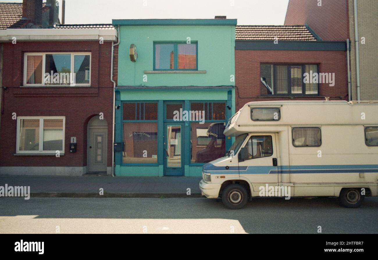 White RV in front of a colorful building Stock Photo - Alamy