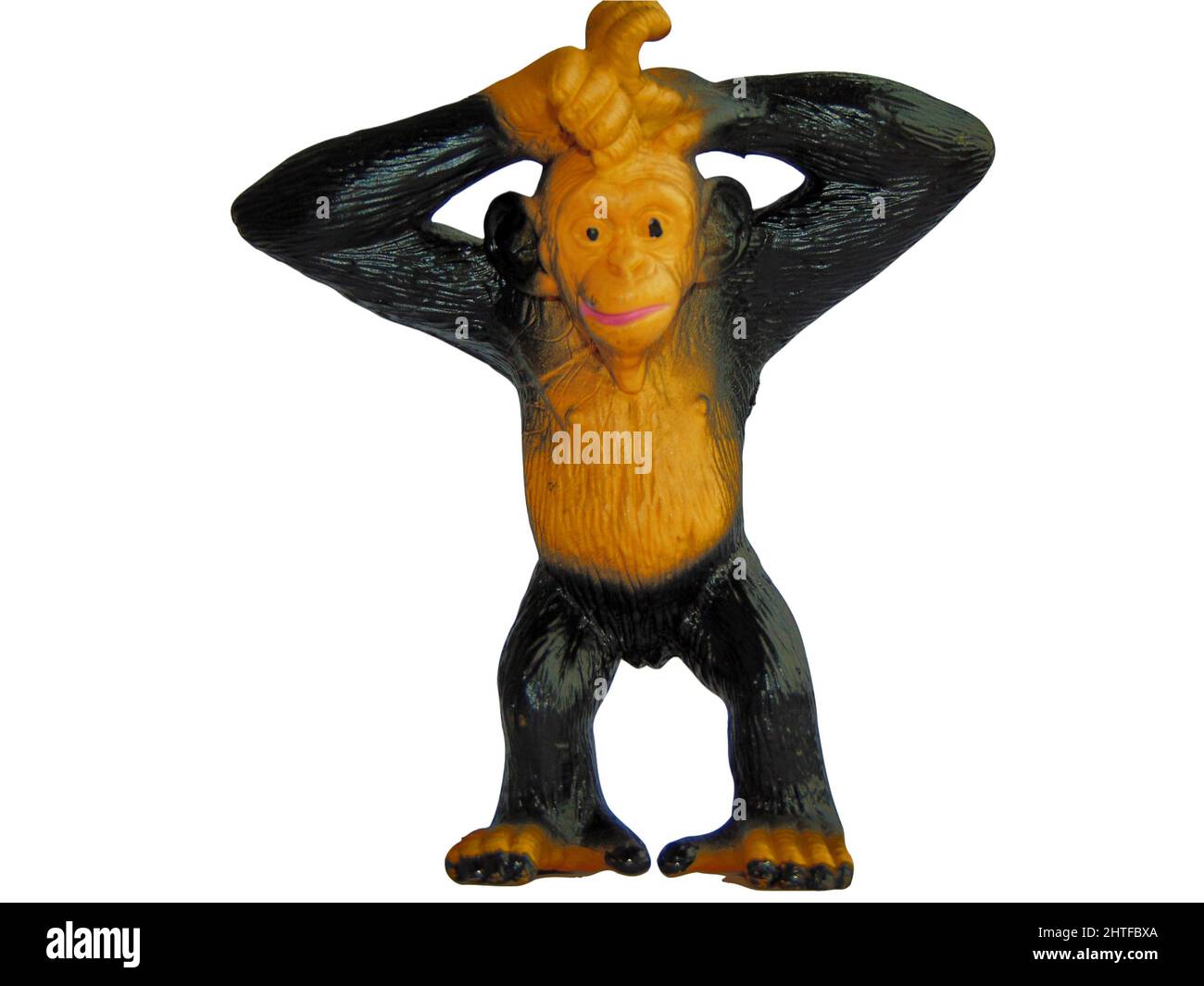 Closeup of a plastic chimpanzee toy isolated on white background Stock ...