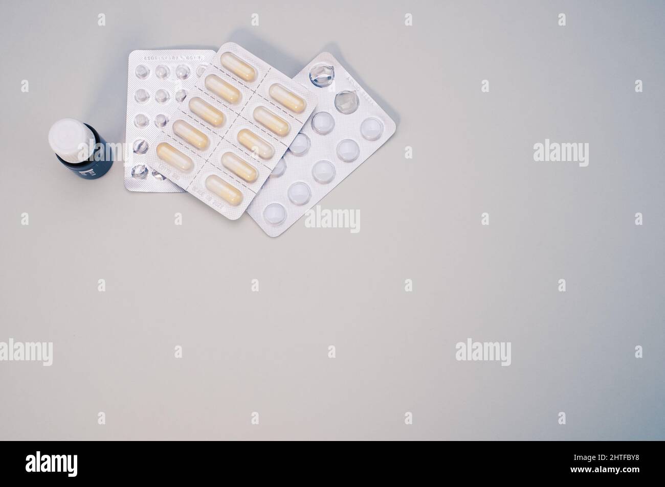 Top view of medicine bottle and tablets isolated on white background ...