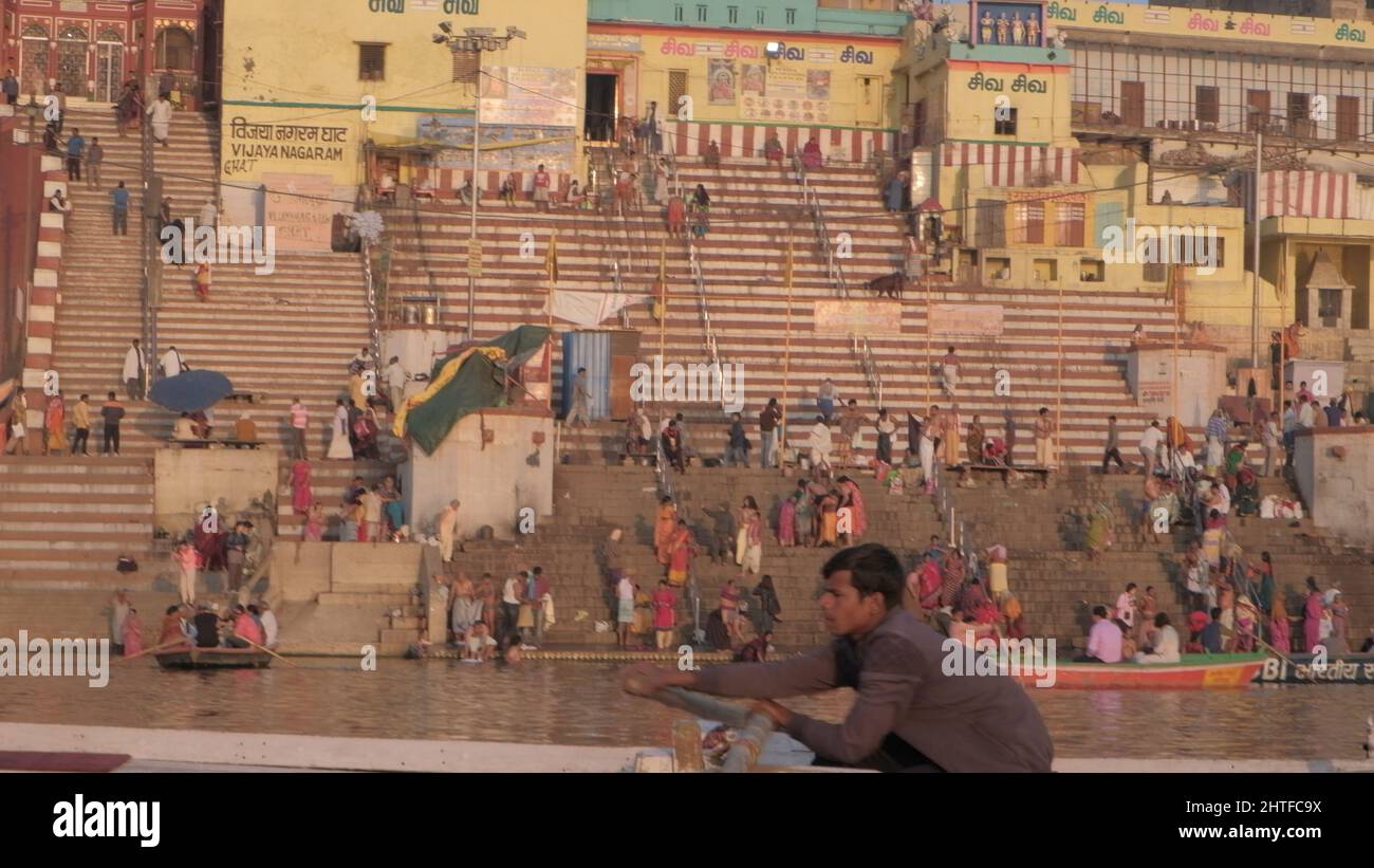 Morning at the banks of the sacred river Ganges in holy Varanasi or ...
