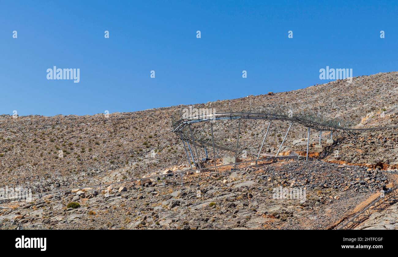Outdoor roller coaster attraction in the mountains Stock Photo - Alamy
