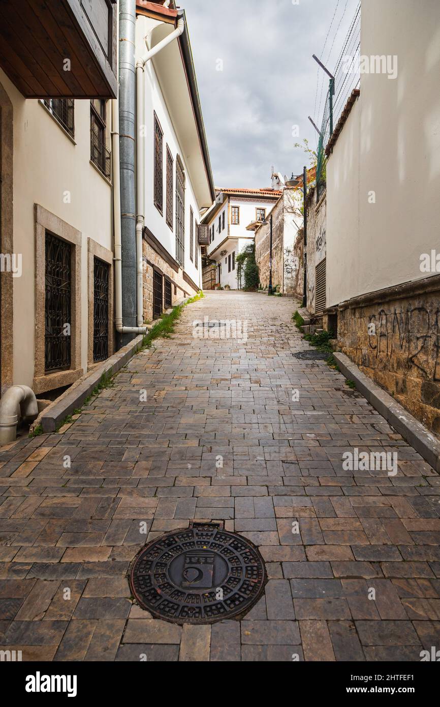 narrow pedestrian street with low buildings in the style of European ...