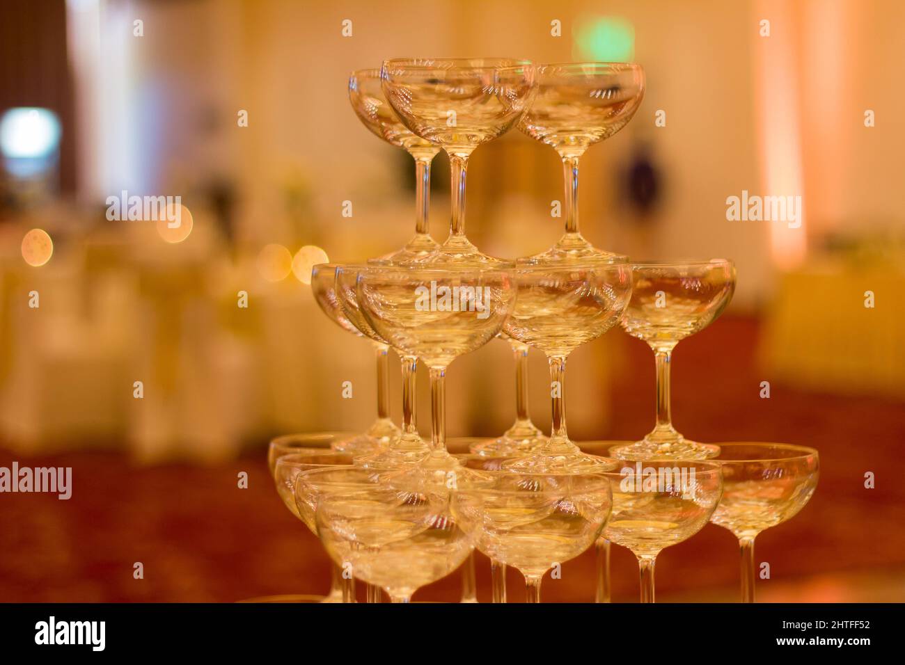 Closeup of a champagne tower on a table in a restaurant during an event ...