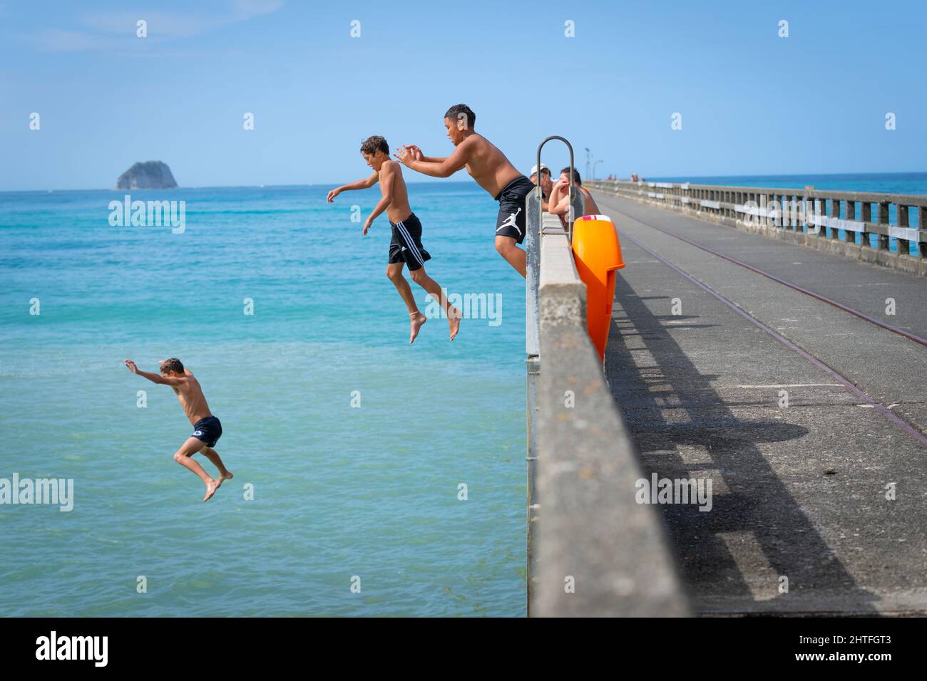 Tolaga Bay New Zealand - February 5 2022; Local boys jumping of Tolaga ...