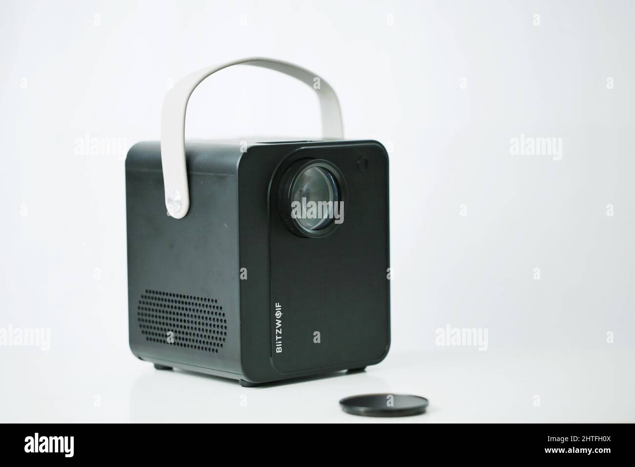 Photo of Blitzwolf portable projector with remote control isolated on a ...