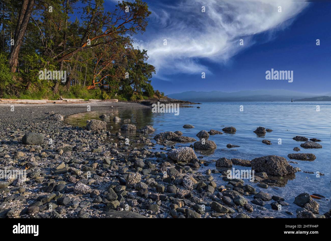 Beautiful rocky shore at a tropical beach Stock Photo - Alamy