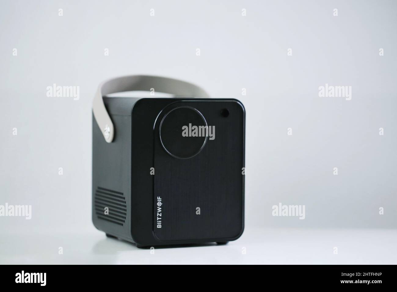 Photo of Blitzwolf portable projector with remote control isolated on a ...
