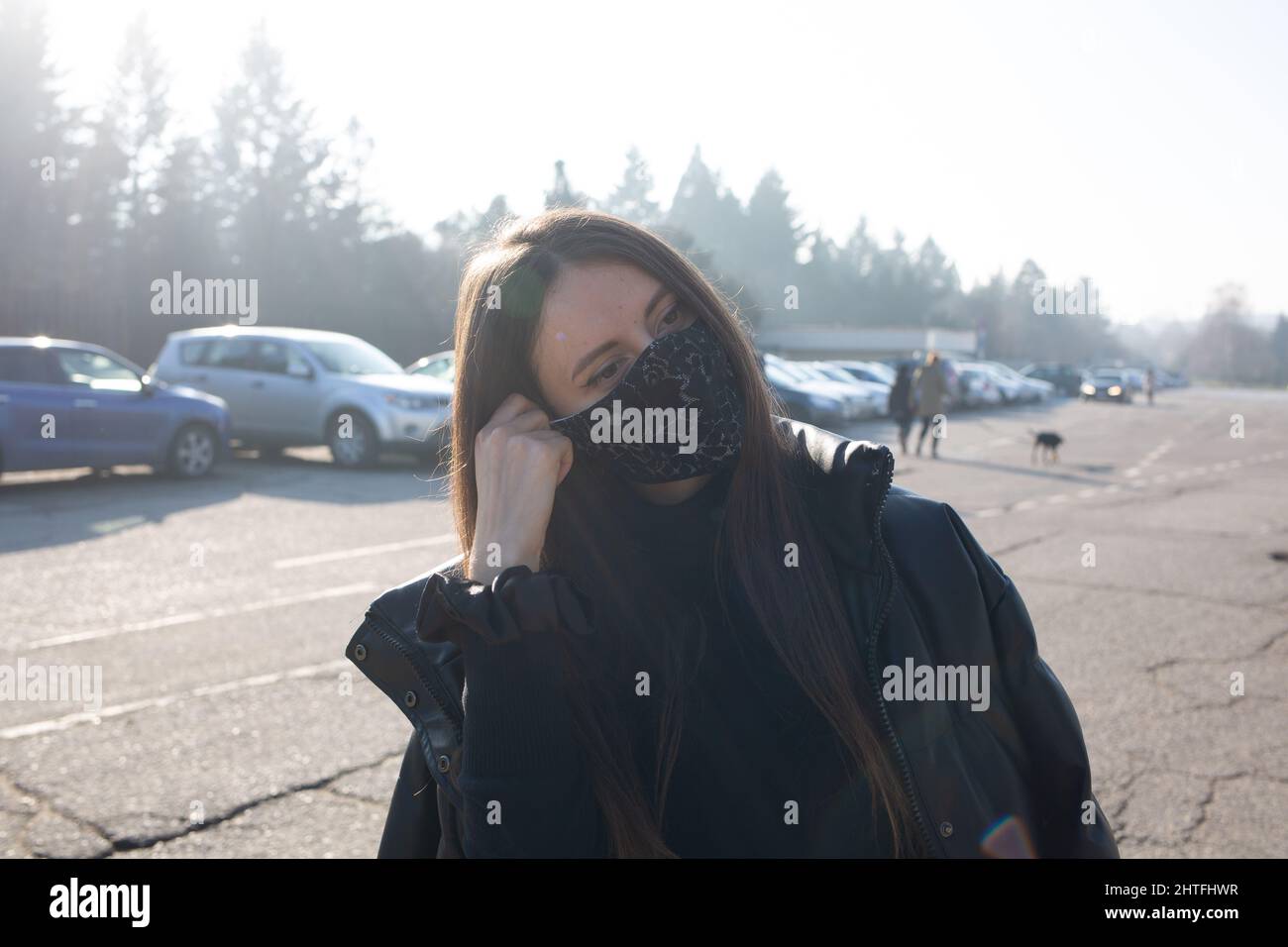 girl wearing mask outside on parking during pandemic covid-19 Stock ...