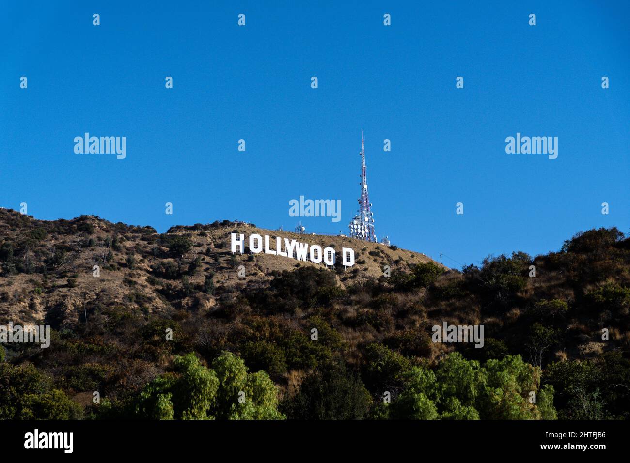 Hollywood sign on mountain against a clear blue sky in Los Angeles ...
