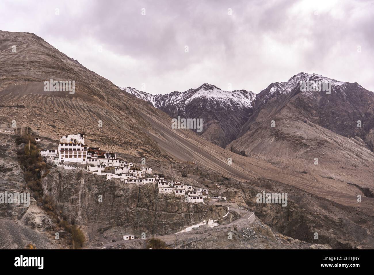 Aerial view of Diskit Gompa monastery surrounded by mountains with snow ...