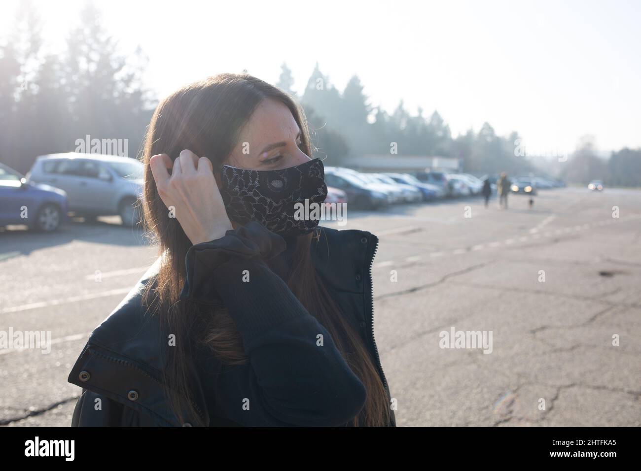 girl wearing mask outside on parking during pandemic covid-19 Stock ...