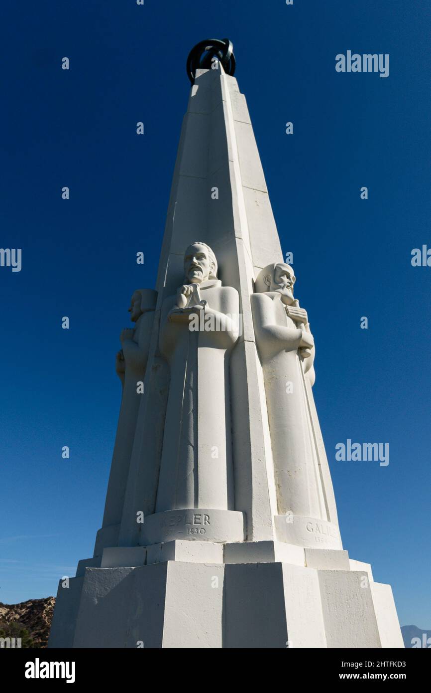 Astronomer's Monument in the Griffith Observatory against a blue sky in ...