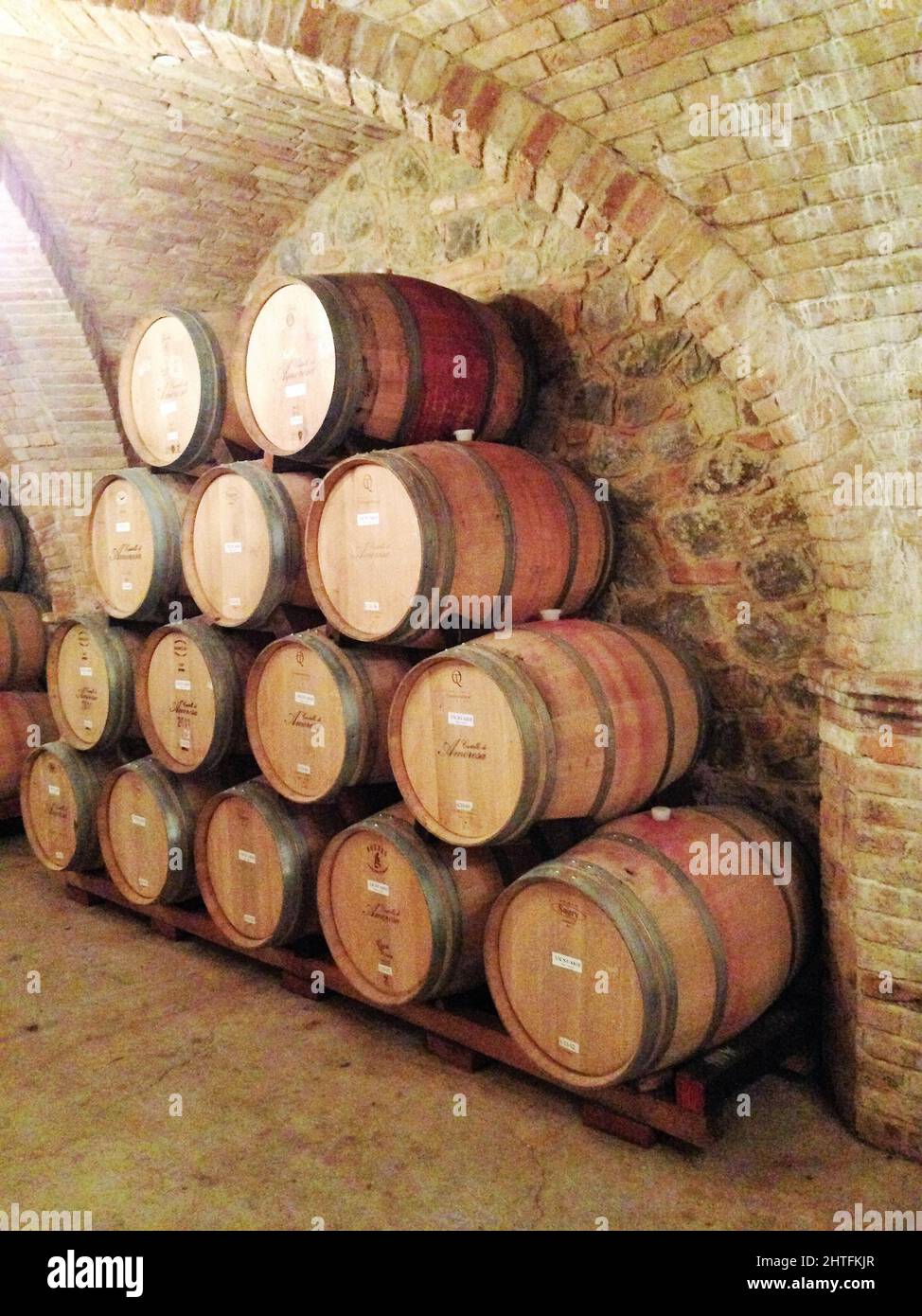 Vertical shot of a heap of wooden barrels in a winery in Napa ...