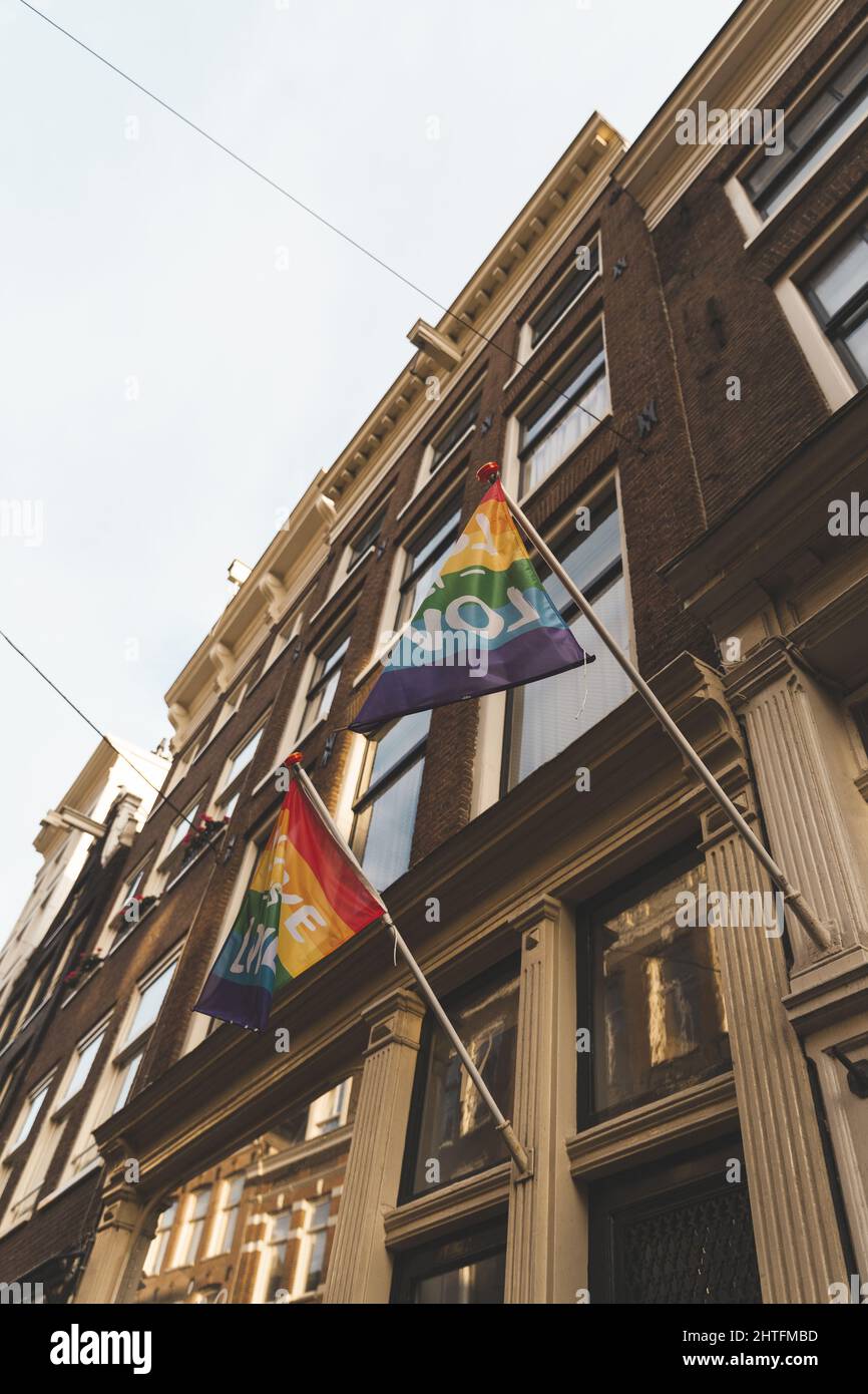 Low angle shot of an architectural building with Pride Flag, Amsterdam ...