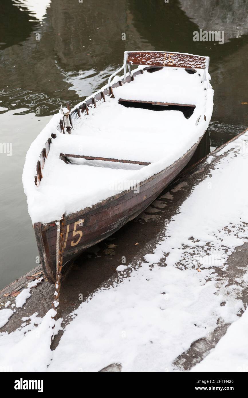 A rowing boat covered in snow, river Wear, city of Durham, England, UK ...