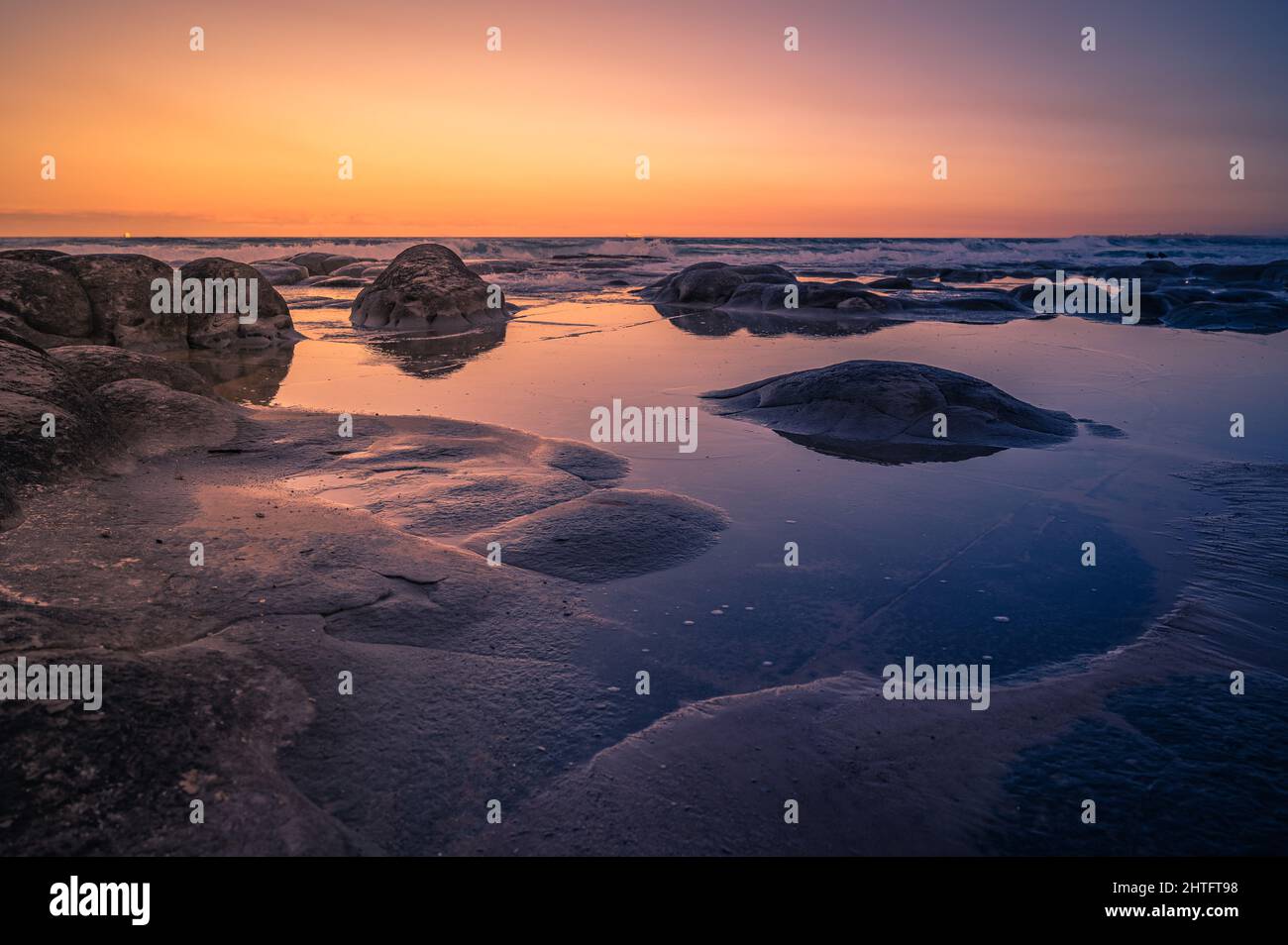 Beautiful rocky coast in Queensland, Australia on sunset Stock Photo ...