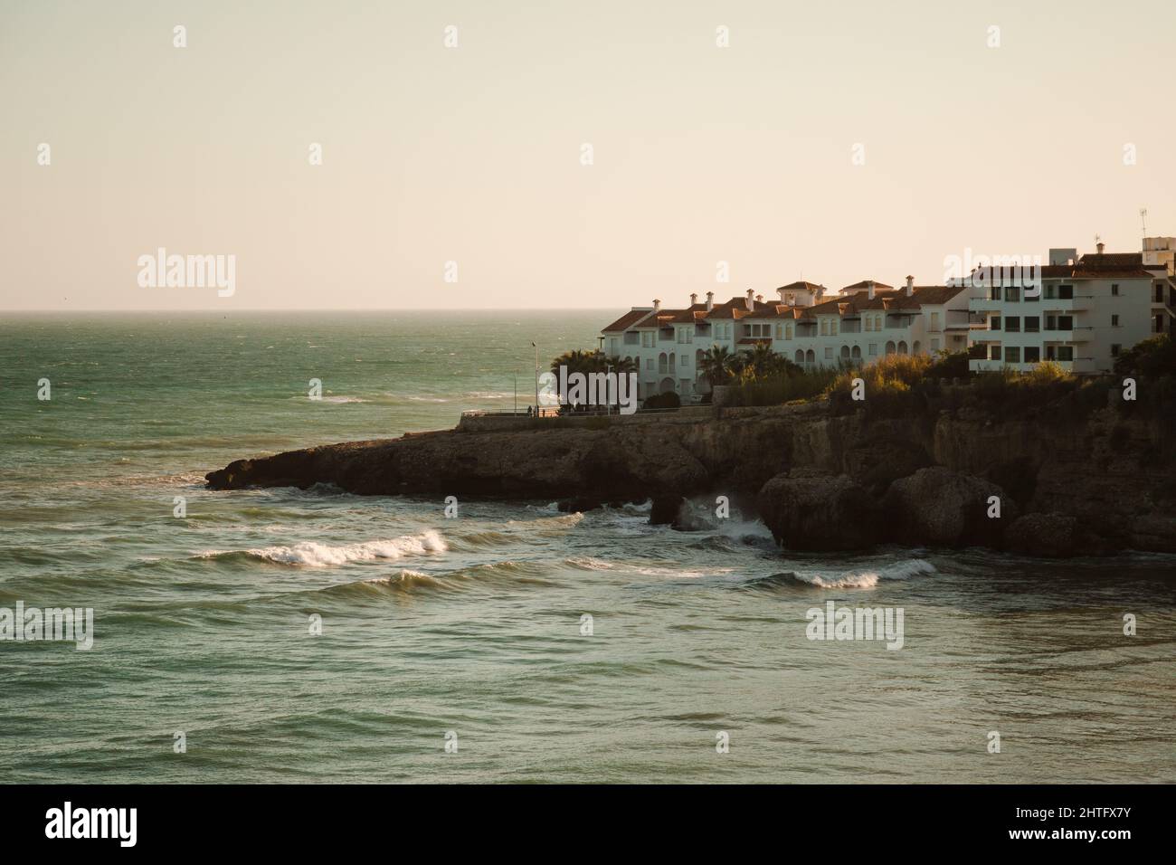 Wavy ocean hitting the rocky beach in Nerja, Malaga, Spain Stock Photo ...