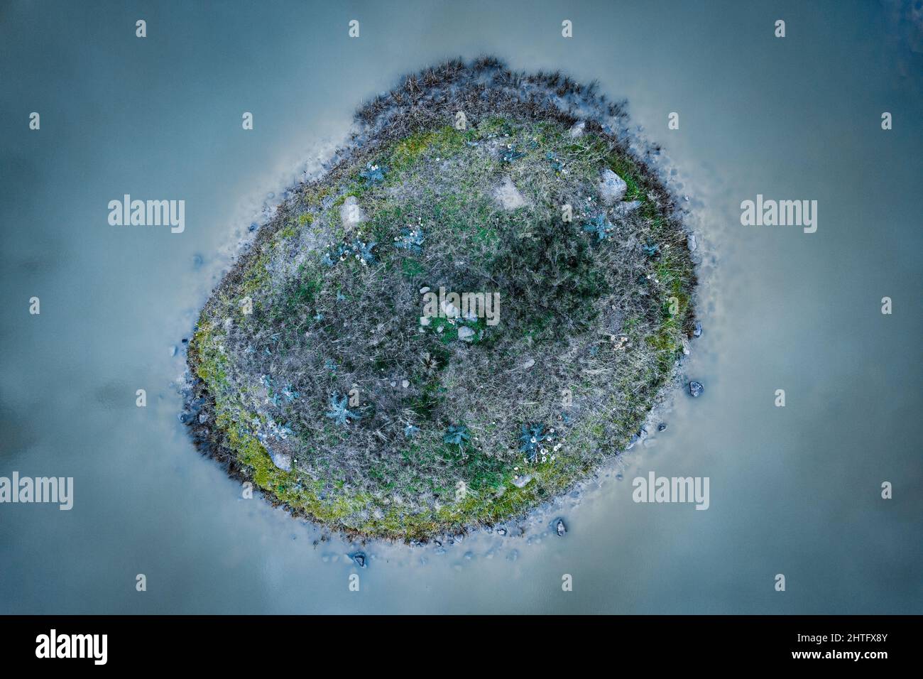 Aerial shot of a small island surrounded by water Stock Photo - Alamy