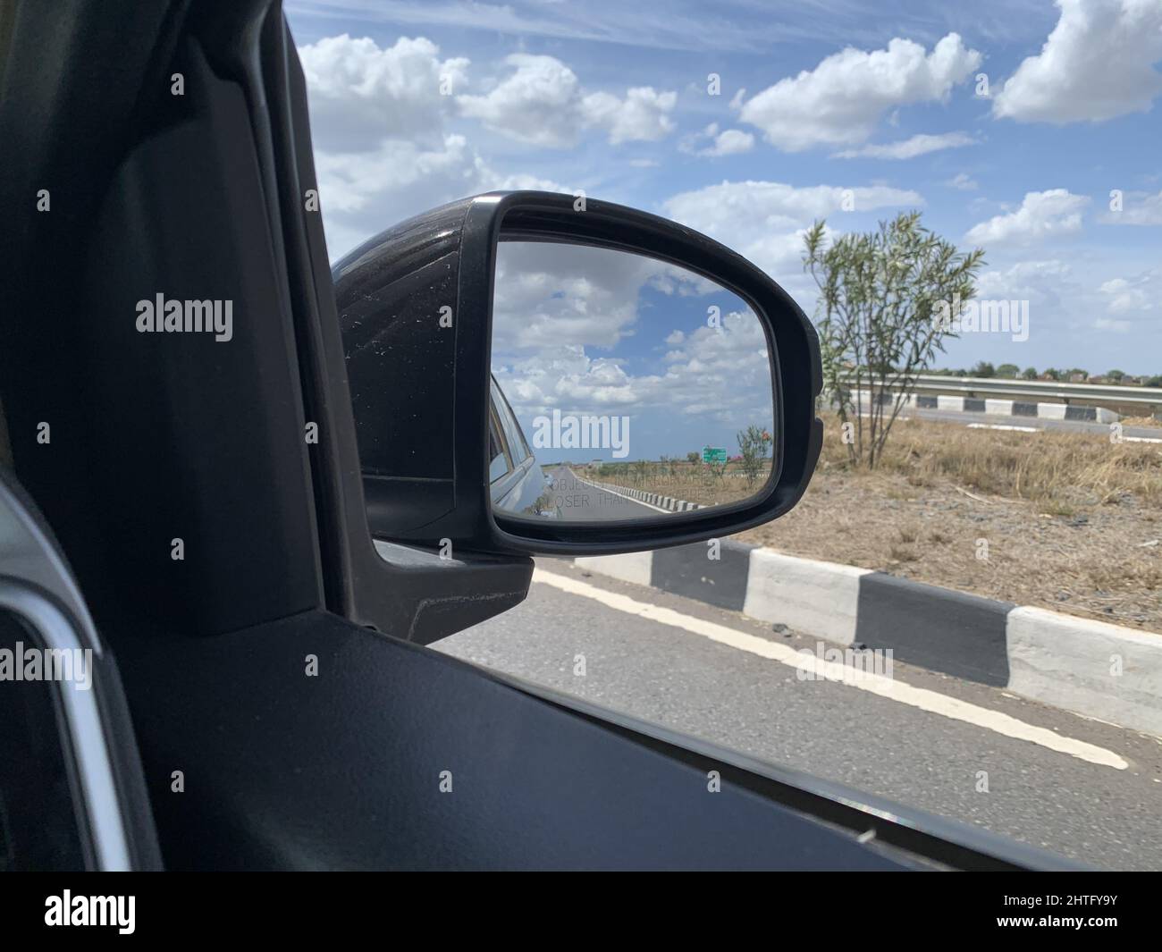 Car side mirror with nature view Stock Photo - Alamy