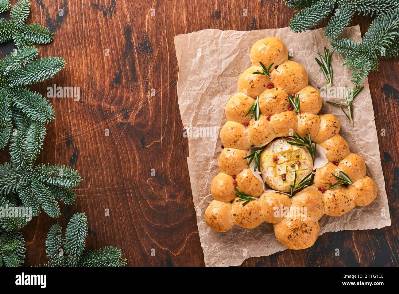Bread buns Christmas tree with Roasted camembert cheese and rosemary on ...